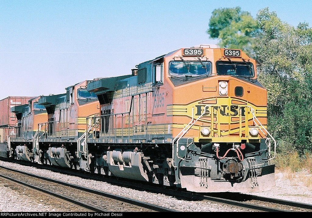 BNSF C44-9W #5395 Leads aneastbound stack train across Impala Rd.